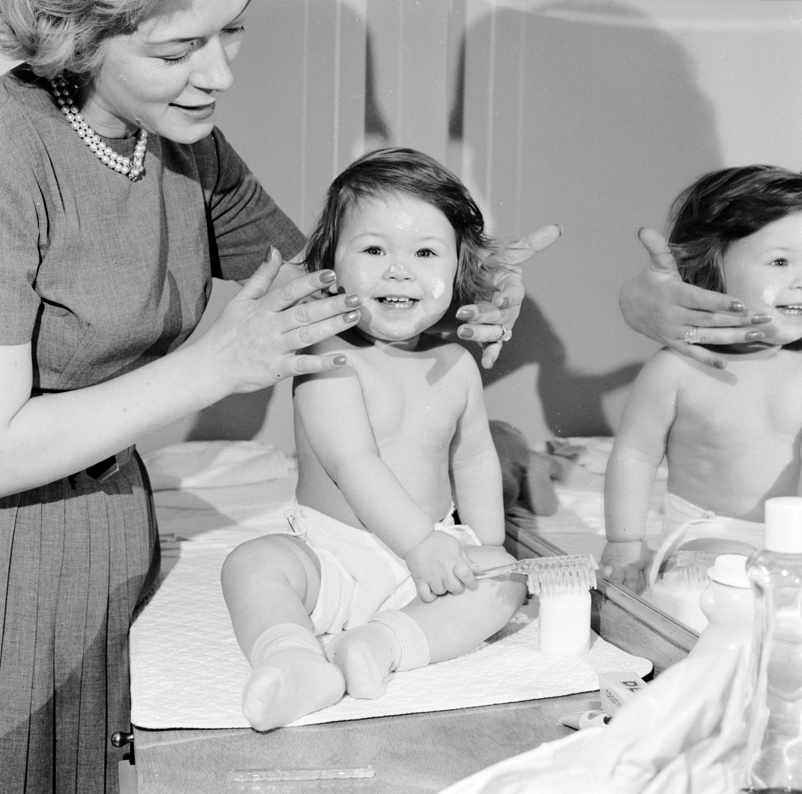 A 1950s Mother Bringing Up Baby Outlet | www.farmhouse-furniture.co.uk